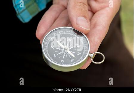 a compass seeking orientation in nature Stock Photo - Alamy