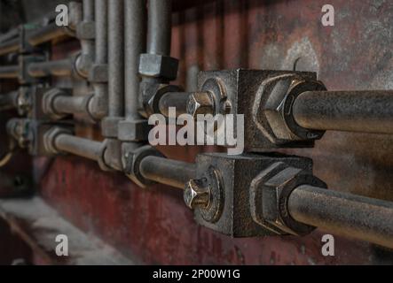 hydraulic pipes of a historic machine Stock Photo - Alamy
