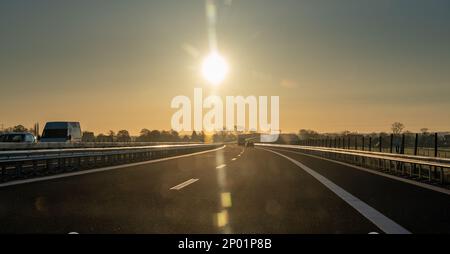 Driving into the sun at a German Autobahn. Symbol for the danger of ...
