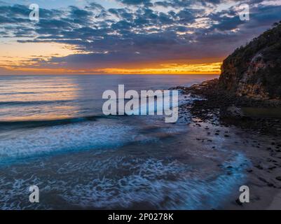 Aerial sunrise seascape with clouds at Macmasters Beach on the Central ...