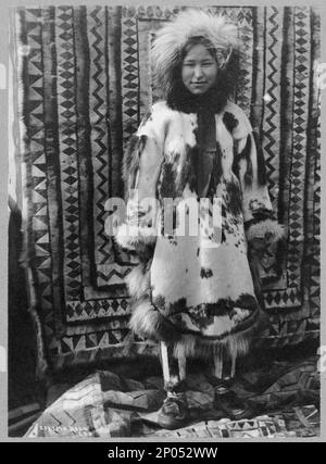 Eskimo girl wearing clothes of all fur isolated on white Stock Photo ...