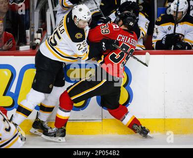 Boston Bruins' Brandon Carlo, left, and Columbus Blue Jackets ...