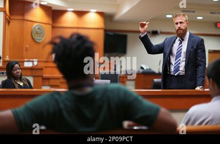 Lawyer David Lee Windecher speaks to a two young offenders, Luis Rangel ...