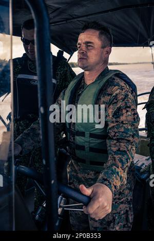 Two Colombian Marine Corps combat riverine boats sail on the Atrato ...