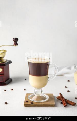 Glass of delicious Cafe Bombon on white background Stock Photo - Alamy