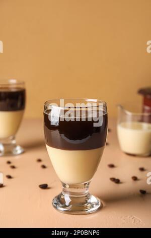 Glass of tasty Cafe Bombon on color background Stock Photo - Alamy