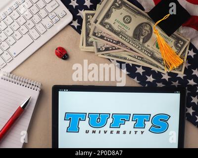 In this photo illustration, Tufts University logo seen displayed on a ...