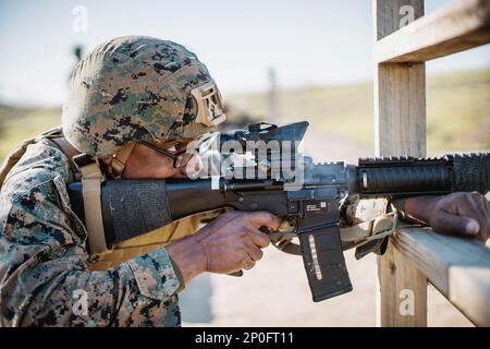 A U.S. Marine engages targets with an M16A4 service rifle during the ...