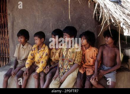 A group of Betta Kurumba, hill tribes of Nilgiris sitting the hut at ...