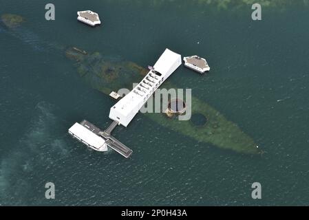 An aerial photo shows the sunken battleship USS Arizona and memorial ...