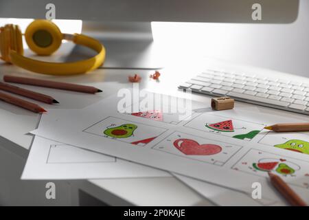 Storyboard with cartoon sketches at workplace. Pre-production process ...