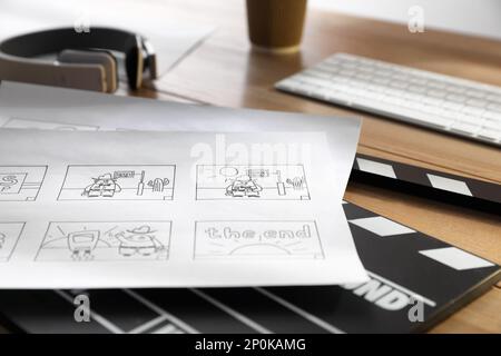 Storyboards with cartoon sketches at workplace, closeup. Pre-production ...