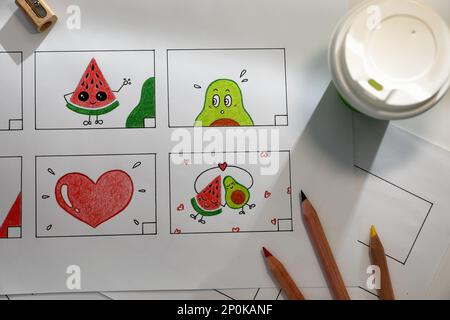Storyboard with cartoon sketches at workplace, flat lay. Pre-production ...