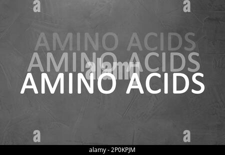 Text Amino Acids on grey stone surface Stock Photo - Alamy