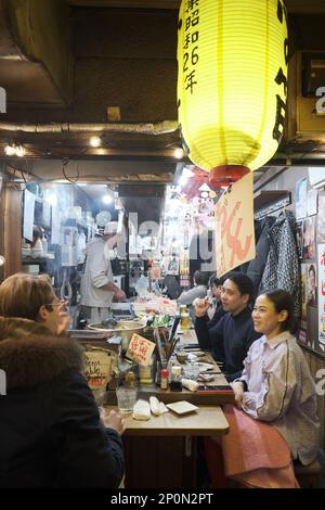 Small alleyway in Japan full of restaurants and people Stock Photo - Alamy