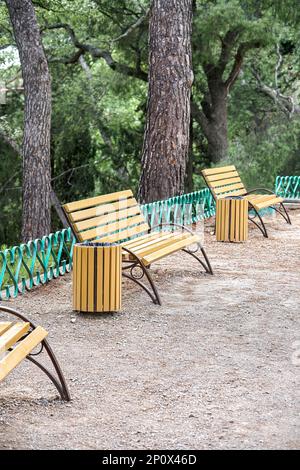 Benches installed in the park for recreation, painted with yellow paint ...