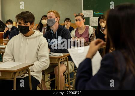 NAHA, Japan - Students and staff at Okinawa International University in ...