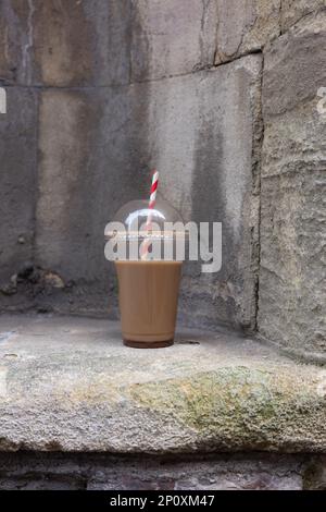 Half drunk chocolate drink in a clear cup and lid Stock Photo - Alamy