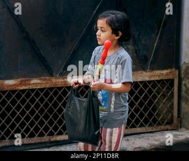 Indian girl celebrating holi festival Stock Photo - Alamy