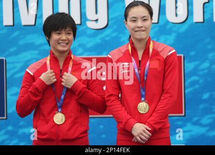 China's Shi Tingmao, right, and Wu Minxia, left, compete during the ...