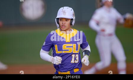 LSU infielder Danieca Coffey (13) throws during an NCAA softball game ...