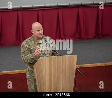 Col. Damon Wells, commander of the 4th Infantry Division Artillery passes the unit colors to ...