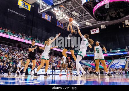 North Carolina State's Madison Hayes (21) drives as North Carolina's ...