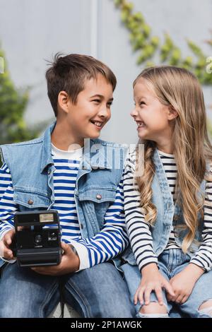 Photo of cheerful cute girl dressed trendy colorful jumper toothy smile ...