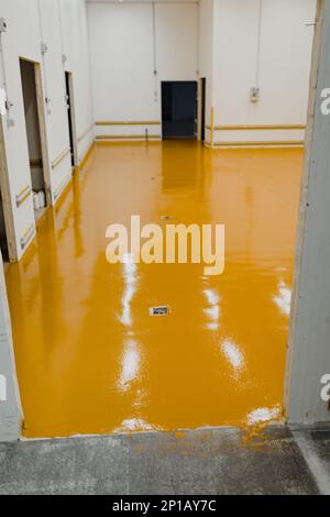 cold storage with new floor made of yellow epoxy resin Stock Photo - Alamy