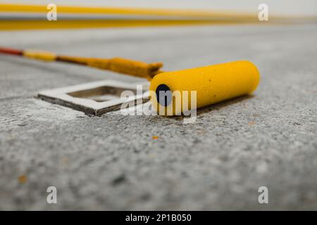 Tools used in epoxy floor painting Stock Photo - Alamy