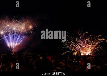 Scenic view of fireworks illuminates the sky with a dazzling display ...