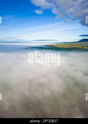 Aerial view of fog caused by a temperature inversion over a rural ...