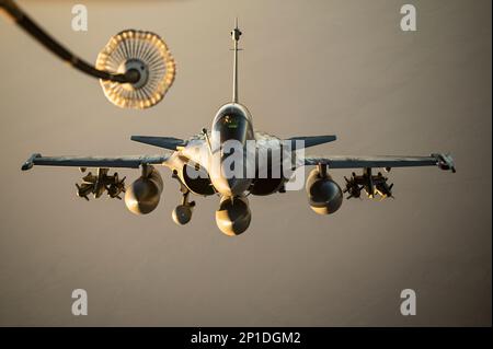 A French Rafale fighter aircraft prepares to receive fuel from a U.S ...