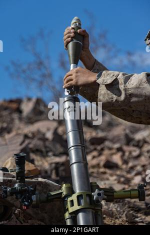 A Marine Mortarman prepares a 60mm mortar during a live-fire range at ...