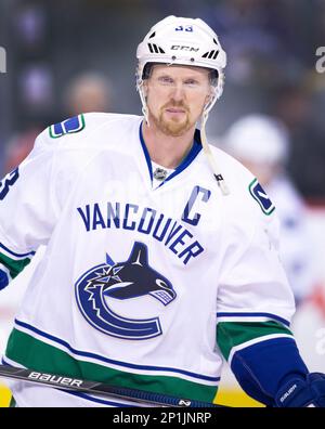 Vancouver Canucks' Henrik Sedin, of Sweden, from left to right, Nicklas ...
