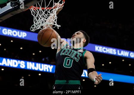 Boston Celtics' Jayson Tatum dunks during the first half of an NBA ...