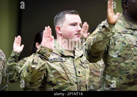 Soldiers under the 81st Readiness Division complete the flexed-arm-hang ...