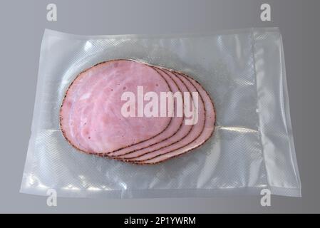 Smoked Ham Slices in vacuum pack for sous vide cooking on gray ...