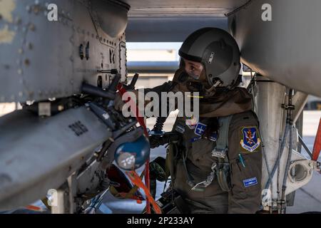 Fighter Pilot in flight wearing flying helmet, dark visor and oxygen ...