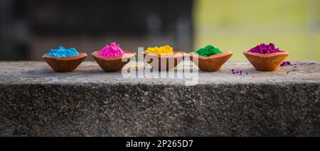 happy holi. gullal or abir, which are colorful powders for holi kept on ...