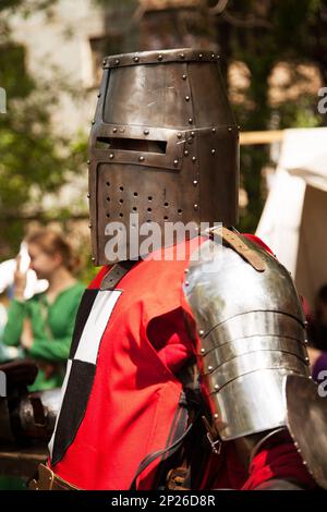 Man wearing medieval great helmet with eye slit, Dirleton Castle, East ...