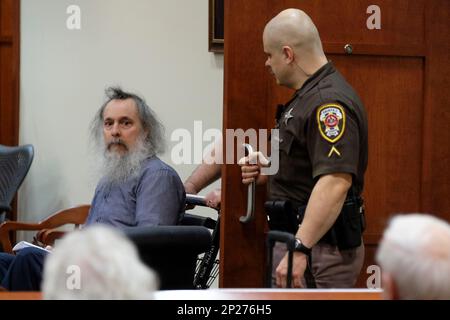 Alleged killer Charles Severance looks to see who is in attendance as ...
