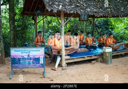 A group of men disabled by landmines play traditional Cambodian music ...