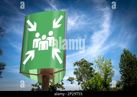 Emergency assembly point sign. Sign indicating where people should ...