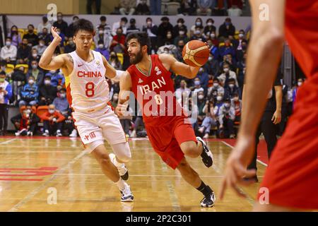 IranHH guard Behnam Yakhchali (right) dribbles past ChinaHH Zhao Rui ...
