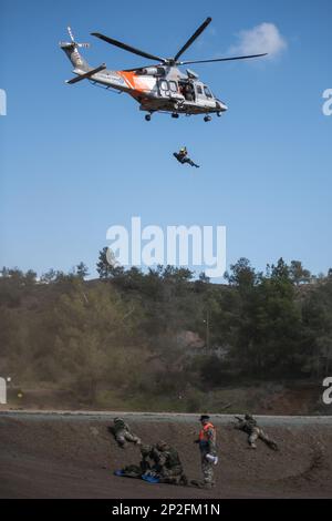 Cypriot troops with the 20th Armored Brigade assist a Cypriot ...