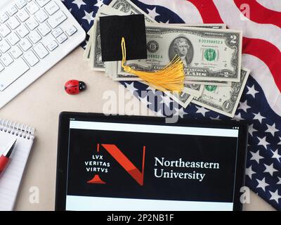 In this photo illustration, Northeastern University logo seen displayed ...
