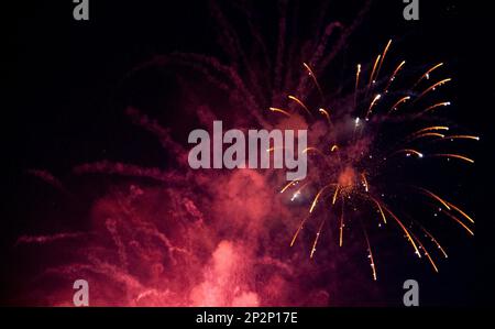 Fireworks burst above Cascade Falls during a Fourth of July fireworks ...