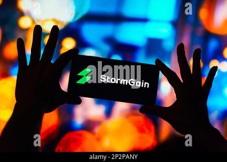 In this photo illustration, the StormGain logo seen displayed on a ...