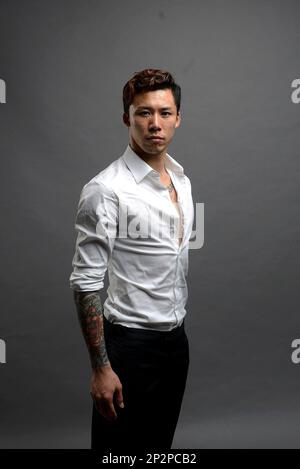 Chinese soccer star Zhang Linpeng poses for photos as he is elected as ...